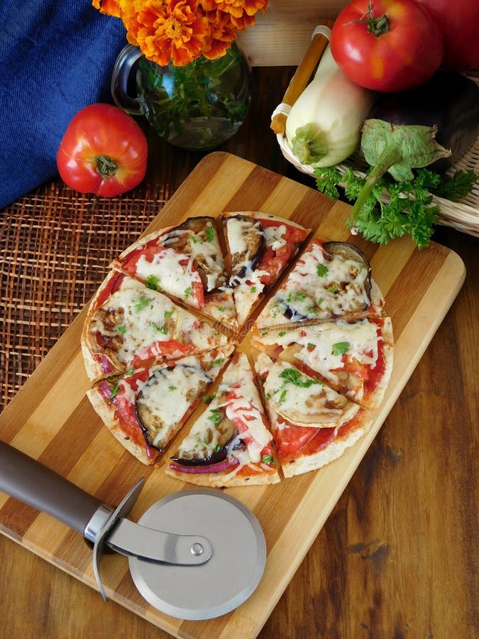 Pizza cut into segments stock photo. Image of cuisine - 98074862