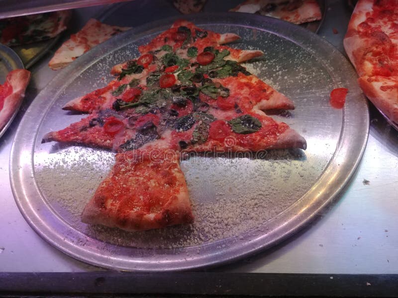 Christmas Tree Shaped Pepperoni and Spinach Pizza on a Metal Platter ...