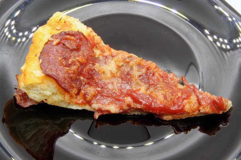 Pizza Cuts on a Black Plate. Pizza Slice on a Black Plate Stock Image ...
