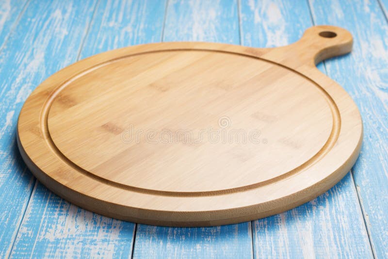 Pizza Cutting Board at Rustic Wooden Table Stock Image - Image of ...