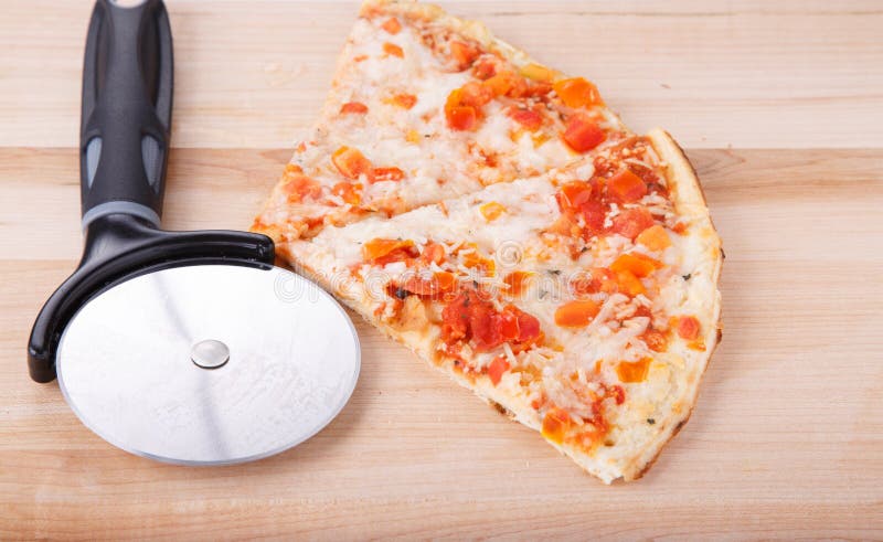 Pizza and Cutting Wheel on Wood Board Stock Photo - Image of circle ...