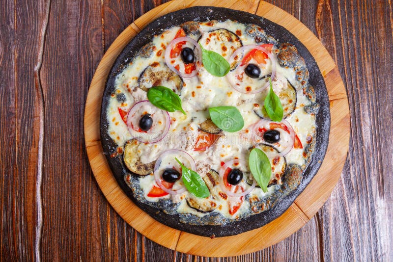 Pizza with Cuttlefish Ink and Eggplant Stock Photo - Image of dish ...