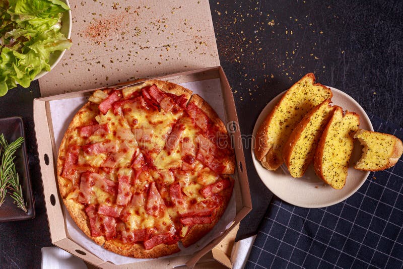 Pizza Delivery Service in a Cardboard Box with Cheese Garlic Bread ...