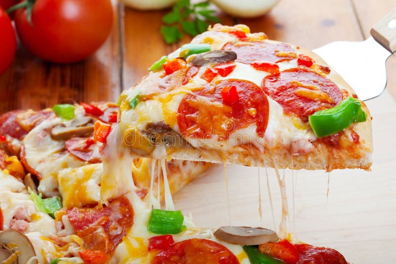 Pizza Deluxe stock image. Image of pizza, fattening, greasy - 15318641
