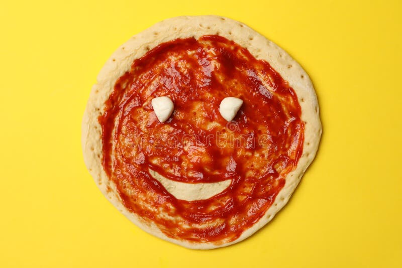 Pizza Dough with Sauce and Smile on Yellow Background Stock Image ...