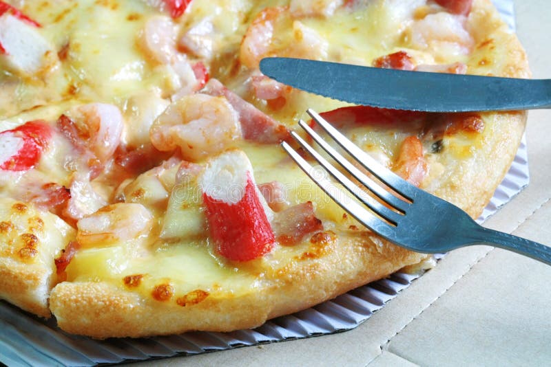 Pizza with fork and knife stock photo. Image of ingredients - 34894648