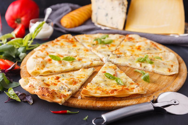 Pizza four cheeses stock photo. Image of rustic, traditional - 100395810