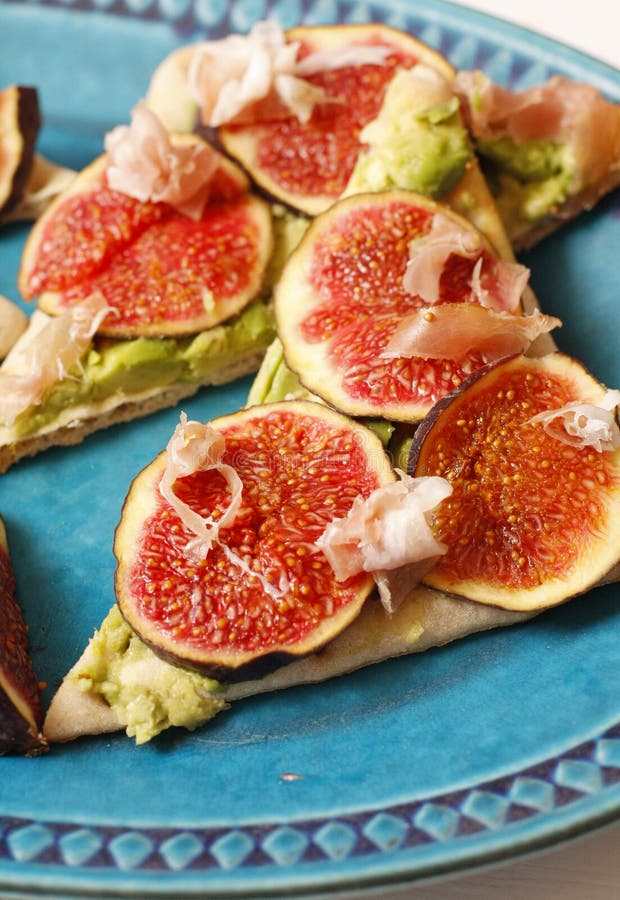 Pizza with Fresh Figs, Avocados and Maple Syrup on Platter Stock Photo ...