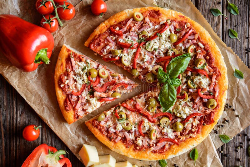 Pizza with Ham, Bacon, Olives, Pepper and Cheese Stock Image - Image of ...