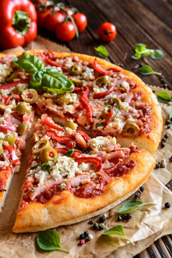 Pizza with Ham, Bacon, Olives, Pepper and Cheese Stock Image - Image of ...