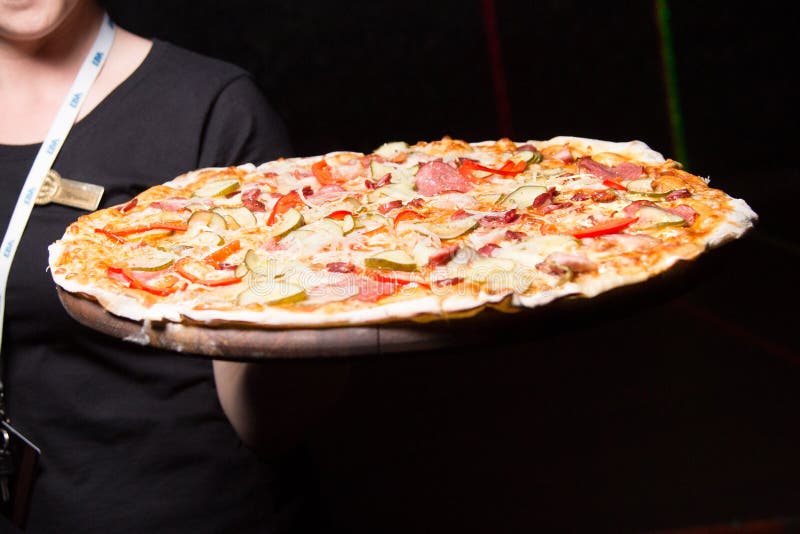 Pizza in hand stock image. Image of homemade, fresh, focus - 53675415