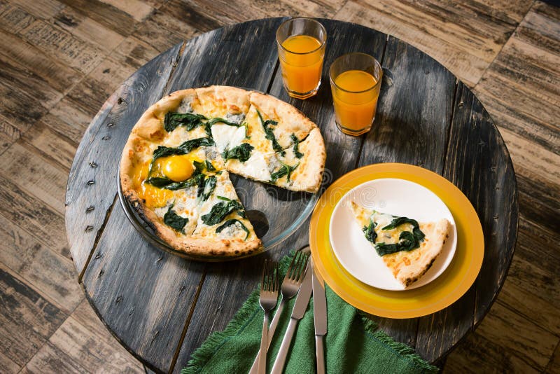 Pizza, Juice in Glasses and Dishes on the Round Table. Home Interior ...