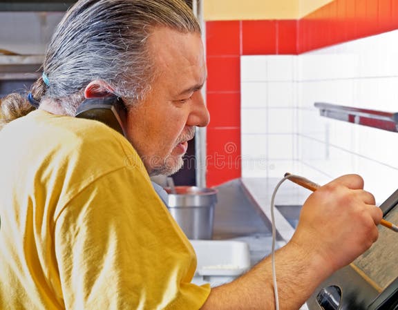 Pizza Maker Taking Phone Order Stock Photo - Image of fattening, junk ...