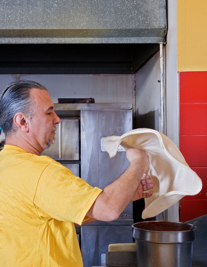 Pizza Maker Puts on the Sauce Stock Image - Image of chef, catering ...