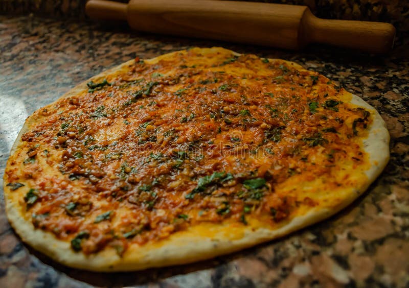 Pizza on the marble table stock photo. Image of cooking - 206350544