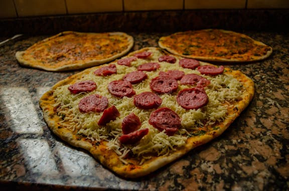 Pizza on the marble table stock image. Image of dinner - 206350549