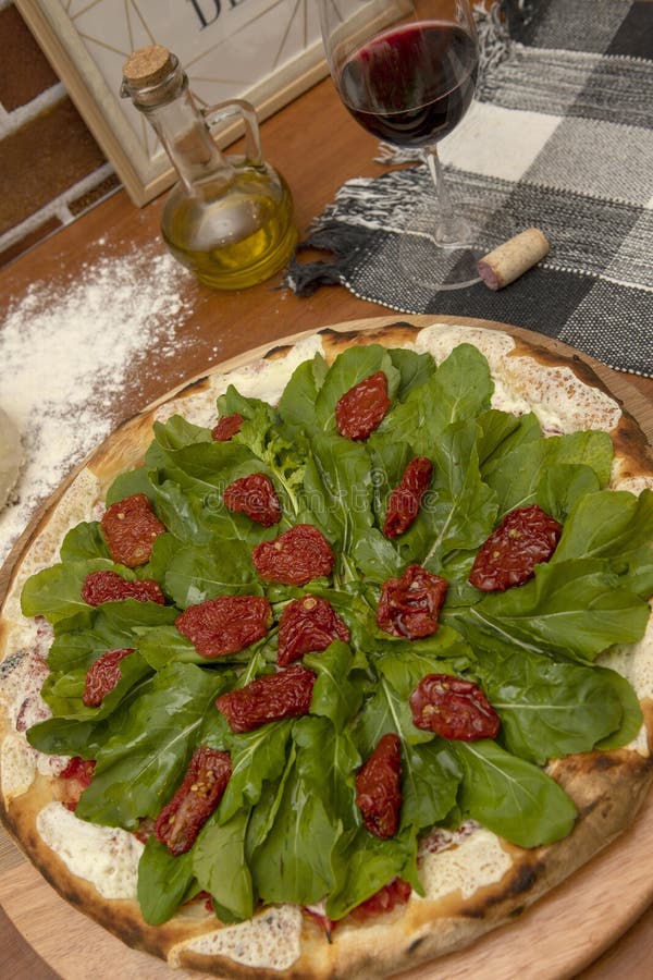 Pizza Rucula and Dried Tomato Stock Image - Image of sauce, bottle ...