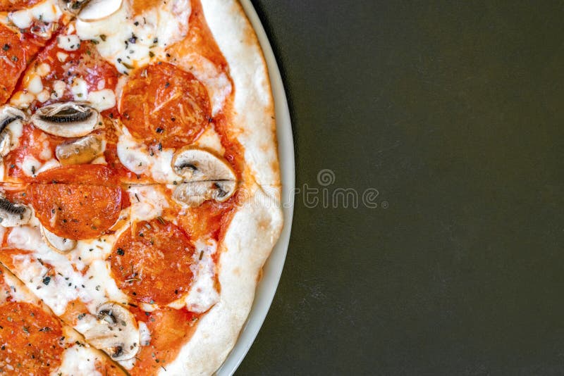 Pizza with Mozzarella, Tomatoes and Mushrooms on the Left Side of the ...