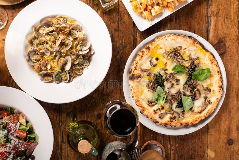 Pizza and Pasta on Wooden Table with Wine Stock Image - Image of ...