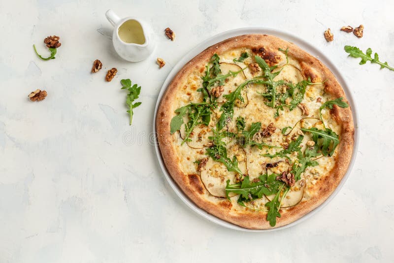 Pizza with Pear, Blue Cheese, Walnut and Arugula on Light Background ...