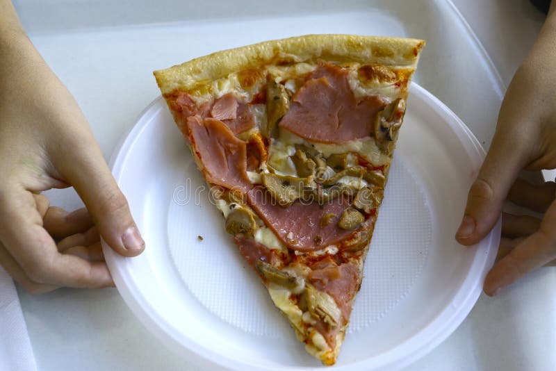 Pizza piece in human hands stock image. Image of delicious - 79175231