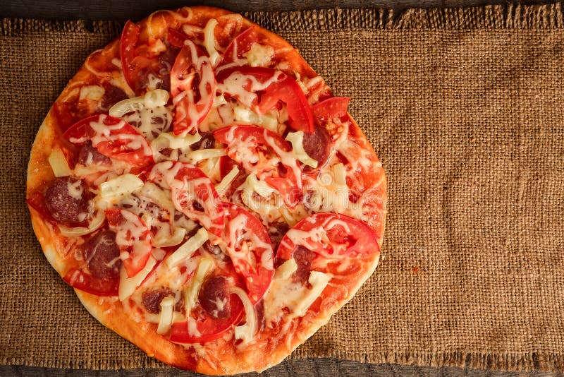 Pizza on Rustic, Vintage Style Wood Background Stock Photo - Image of ...