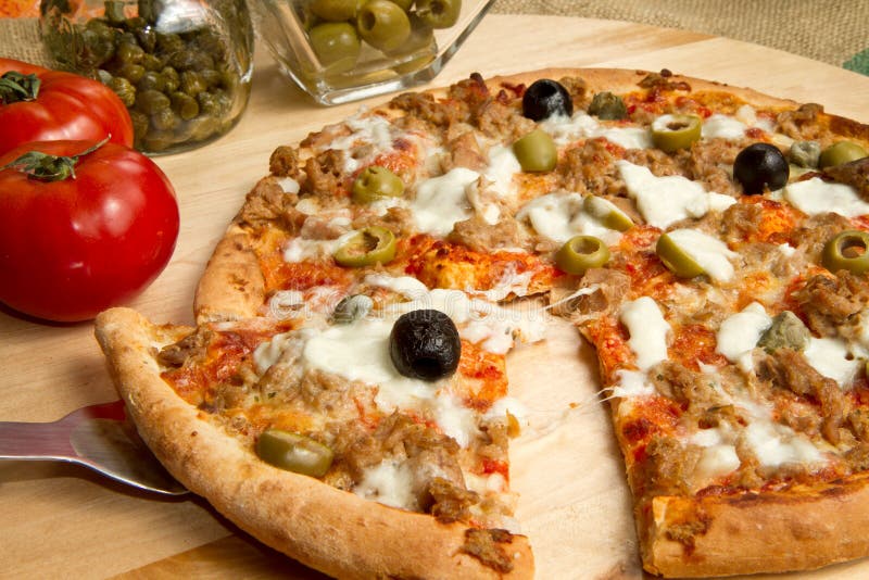 A medium sized Pizza stock photo. Image of pizza, tomatoes - 19456352