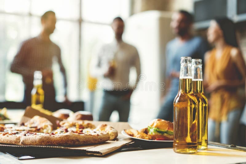Pizza Time. Close-up of Tasty Pizza on the Table, with a Group of Young ...