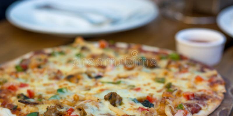 Pizza on wood table stock image. Image of dinner, pizza - 68425655