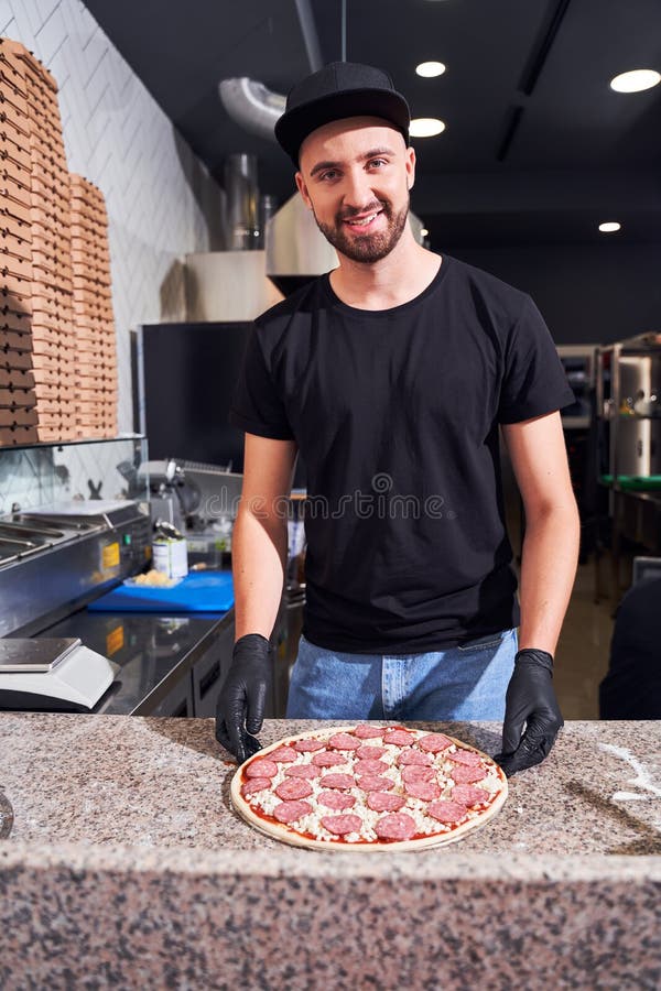 Pizzaiolo with Beard Making a Pizza Stock Photo - Image of pizzaiolo ...