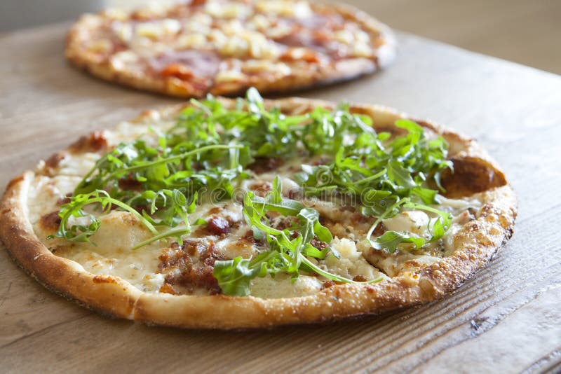 Two Different Kinds of Pizza Stock Image - Image of table, kinds: 153012093