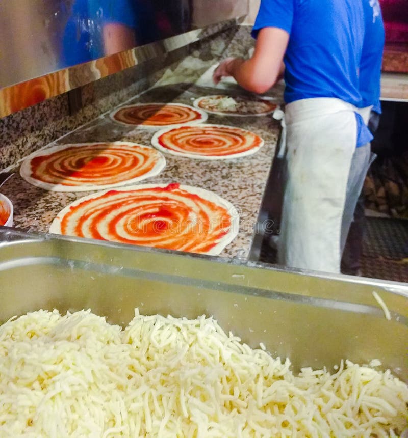 Pizzeria. Particular. Pizza Chef at Work while Creating His Wonderful ...