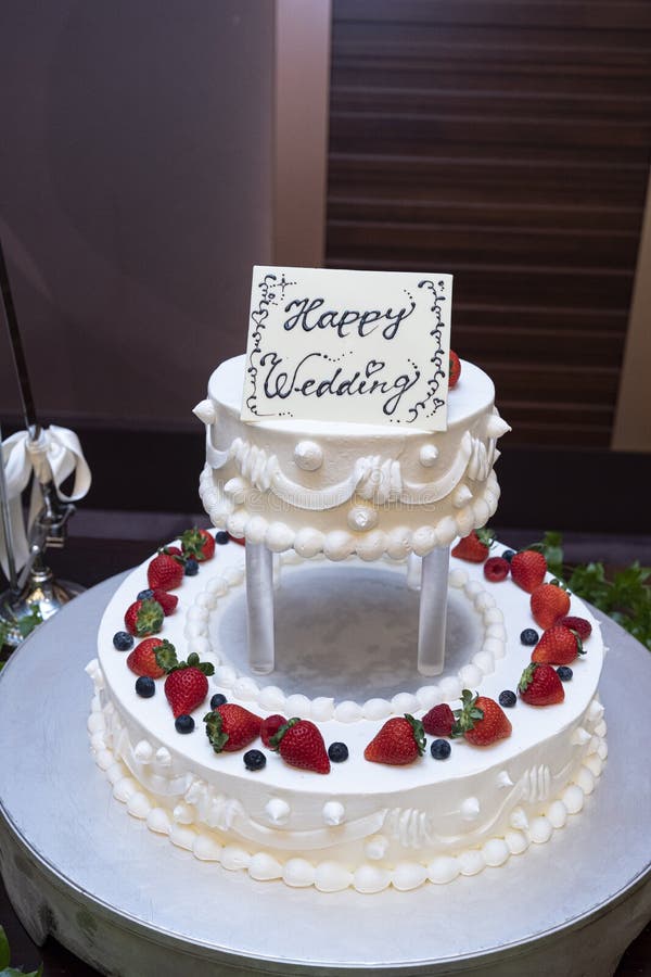 Place a Plate of the Two-tiered Wedding Cake "Happy Wedding Stock Photo ...