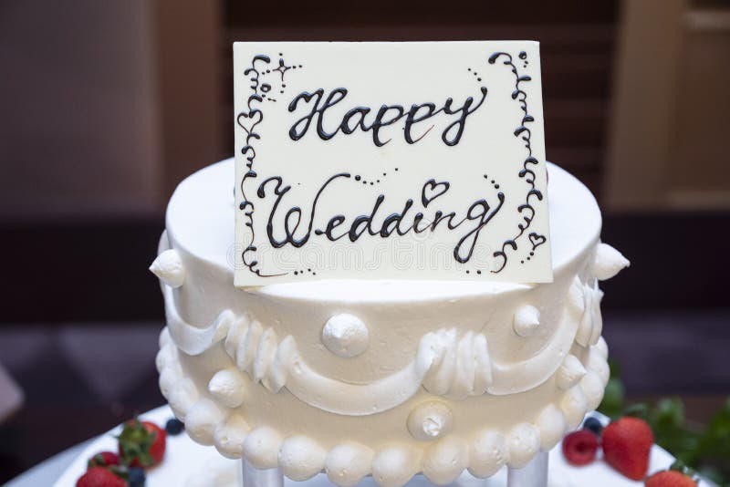 Place a Plate of the Two-tiered Wedding Cake "Happy Wedding Stock Image ...