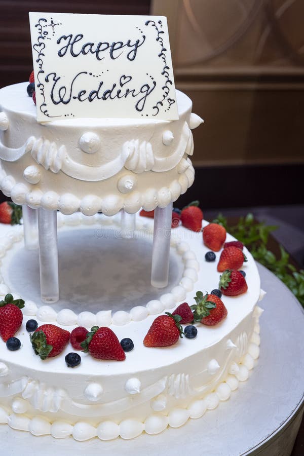 Place a Plate of the Two-tiered Wedding Cake "Happy Wedding Stock Image ...