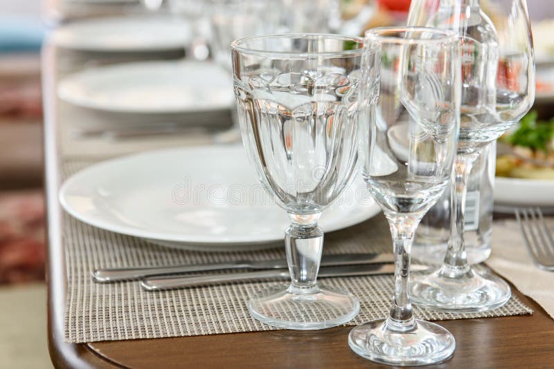 A Table Set with Glasses and Plates. Stock Image - Image of glass, dish ...