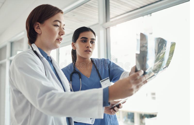 A Place Where Humanity is Loved. Two Young Doctors Checking Exrays in a ...