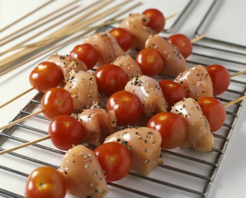 Placing the Brochettes on the Oven Rack Stock Photo - Image of tomato ...