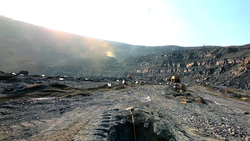 Placing a Charge in the Soil for Blasting Operations. Explosives in the ...