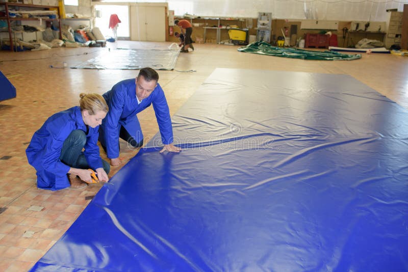 Placing sheet on floor stock photo. Image of working - 89690014