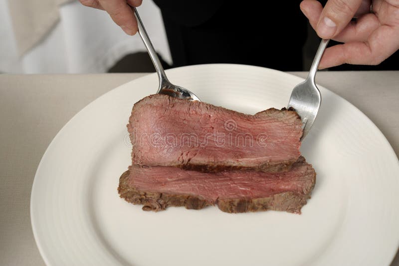 Placing the Sliced Roast Beef in a Plate Stock Photo - Image of waiter ...