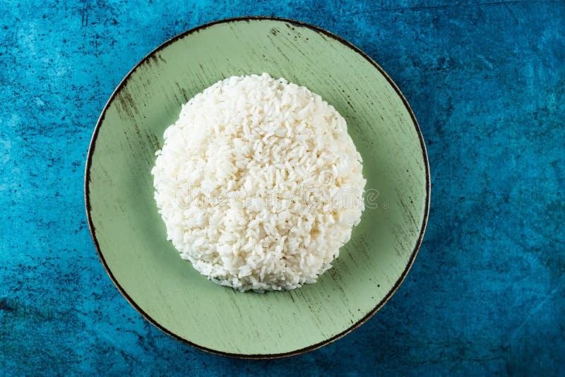 Plain Boiled Rice with Pickle in a Plate Top View on Marble Background ...