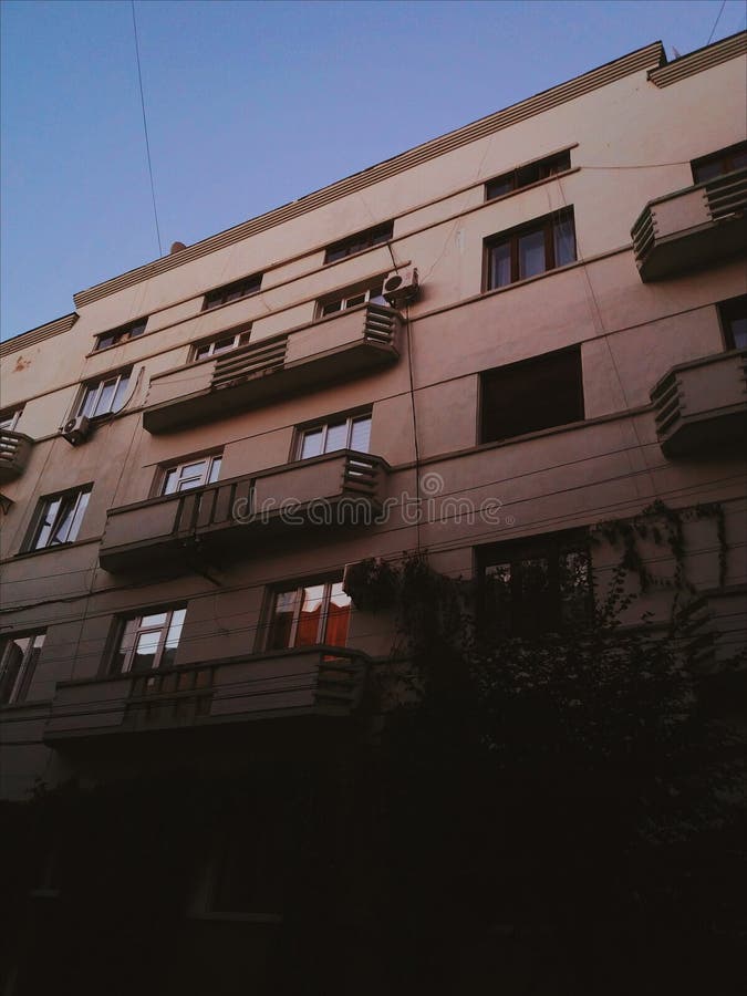 Plain Building Wall with Gutter and Windows Stock Image - Image of ...