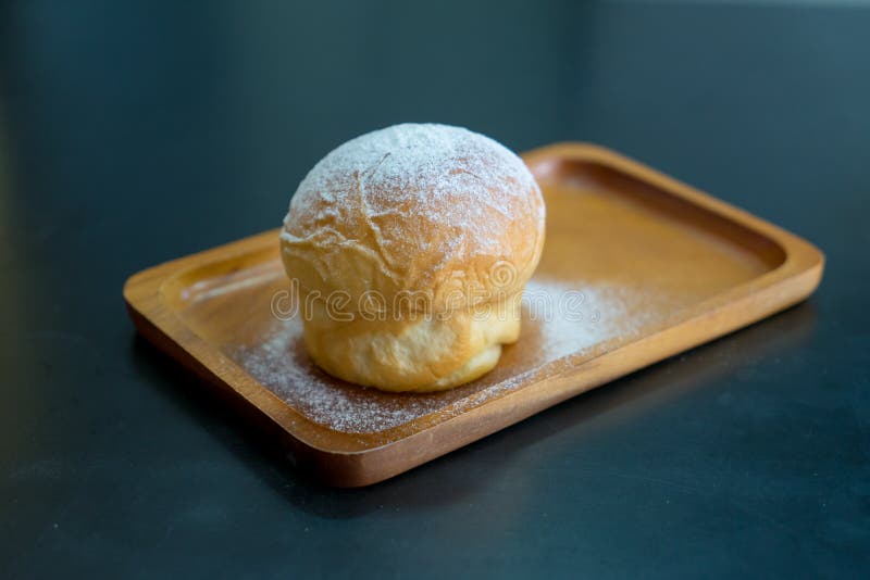 Plain Butter Bread with Icing Sugar Powder on Wooden Plate Stock Image ...
