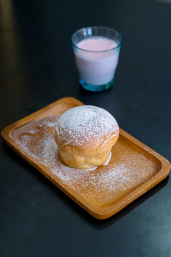 Plain Butter Bread with Icing Sugar Powder on Wooden Plate Stock Photo ...