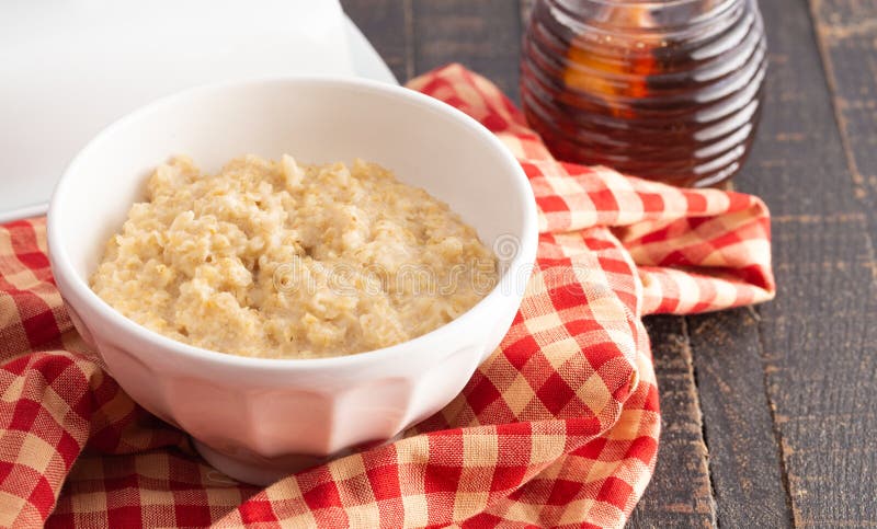 Plain Oatmeal on a Wooden Table with Checkered Table Cloth Stock Photo ...