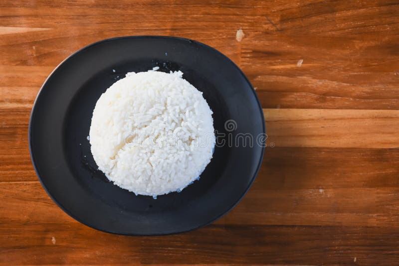 Plain Rice on a Black Plate on the Table Stock Photo - Image of black ...