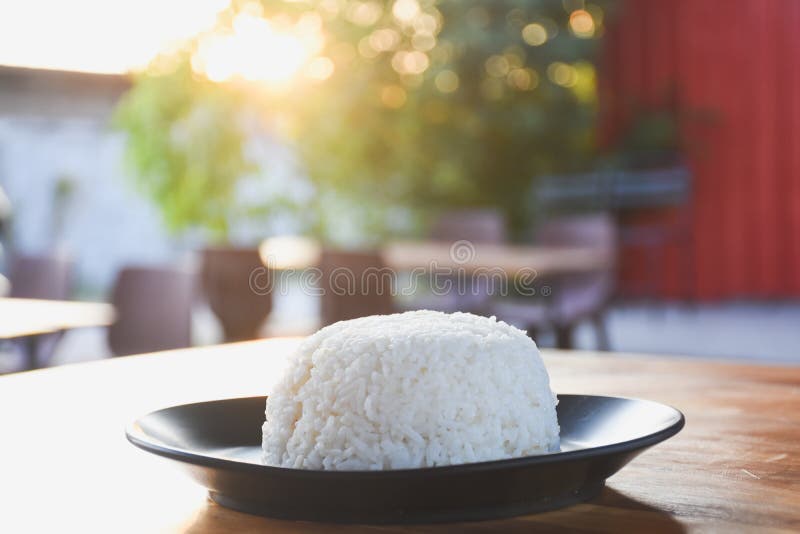 Plain Rice on a Black Plate on the Table Stock Photo - Image of dish ...