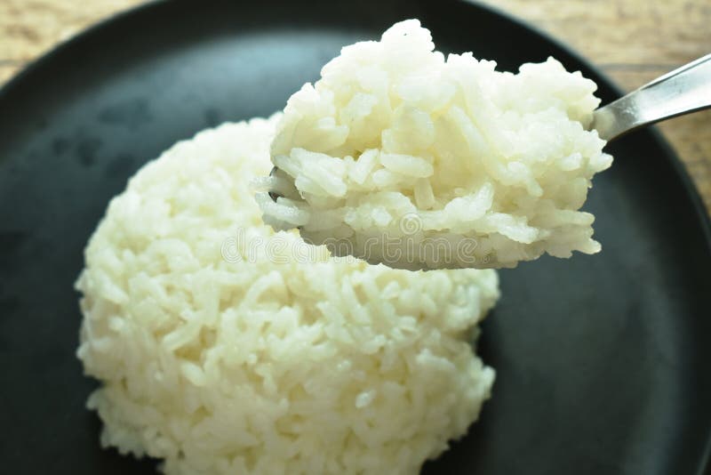 Plain Rice Scooping in Silver Spoon on Plate Stock Photo - Image of ...