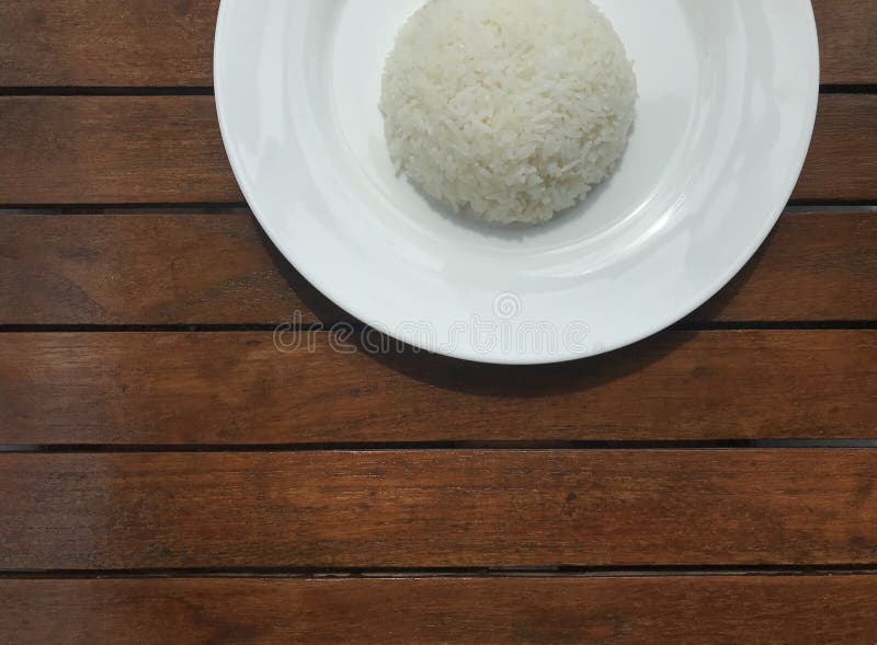 Plain Thai Rice on White Plate Put on Brown Wooden Table Stock Photo ...